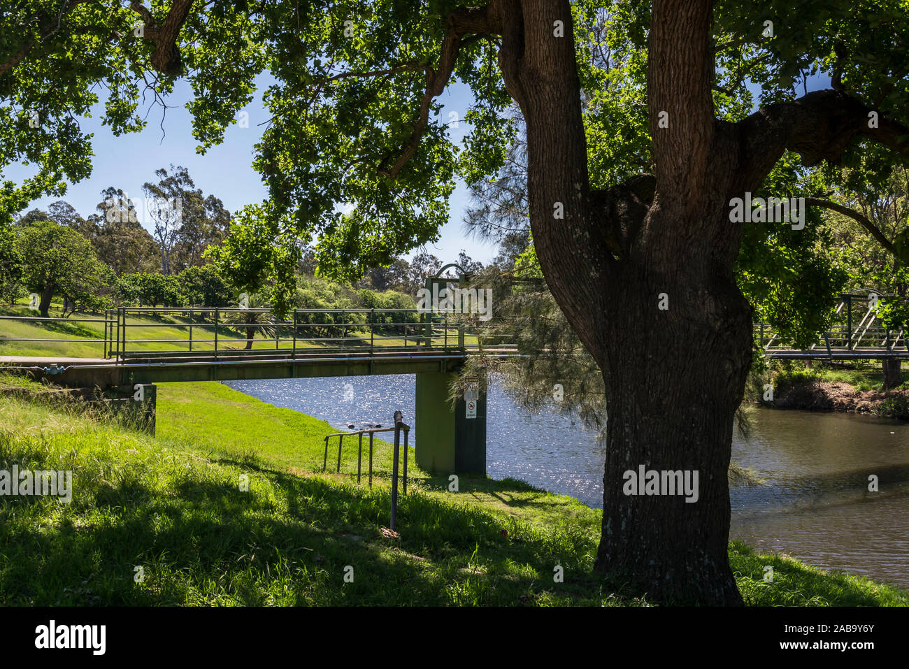 Footbridge crossing the Parramatta river in the Parramatta Park, in the ...