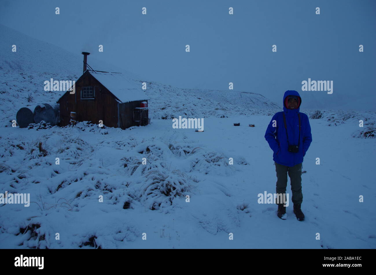Thai female hiker. Camp Stream Hut snow. Te Araroa Trail. Two Thumb ...