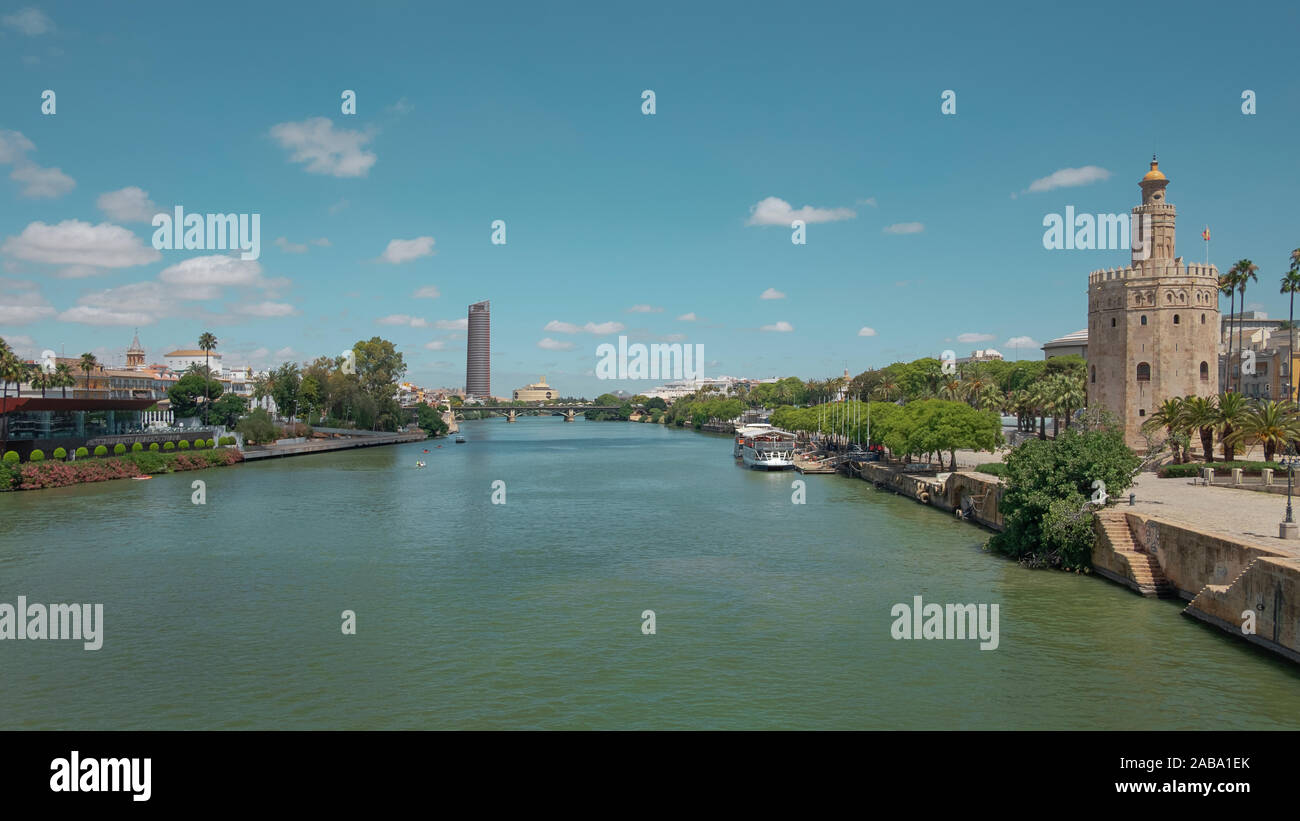 Views of the city from the bridge Puente San Telmo over Guadalquivir ...