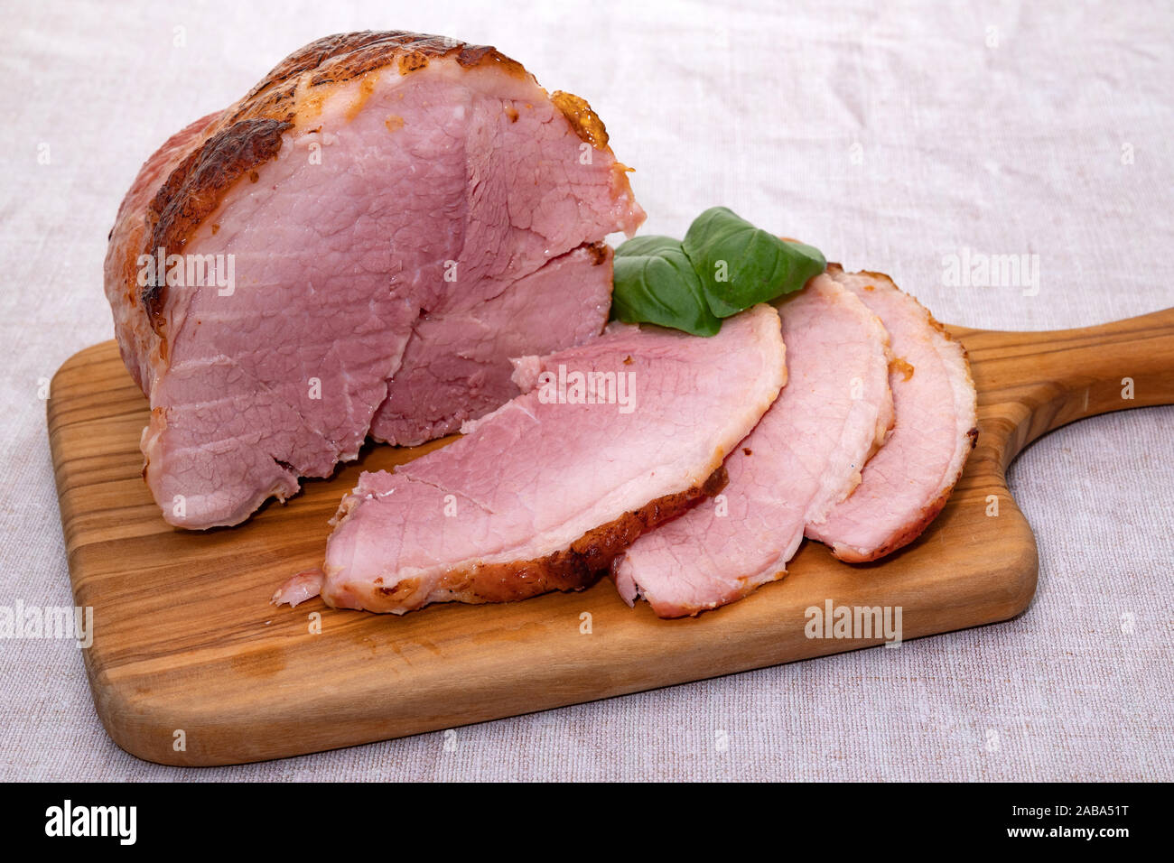 Baked ham with slices Stock Photo - Alamy