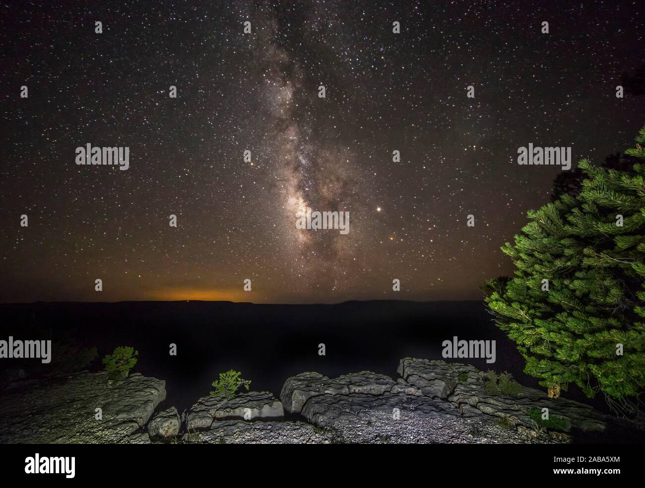The Milky Way Galaxy appears over the Grand Canyon, Arizona Stock Photo ...