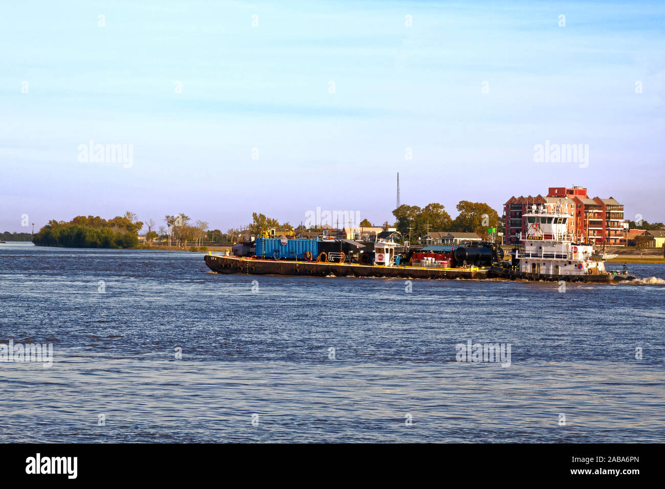 Mississippi River scene; boats; commercial; tug boat pushing barge ...