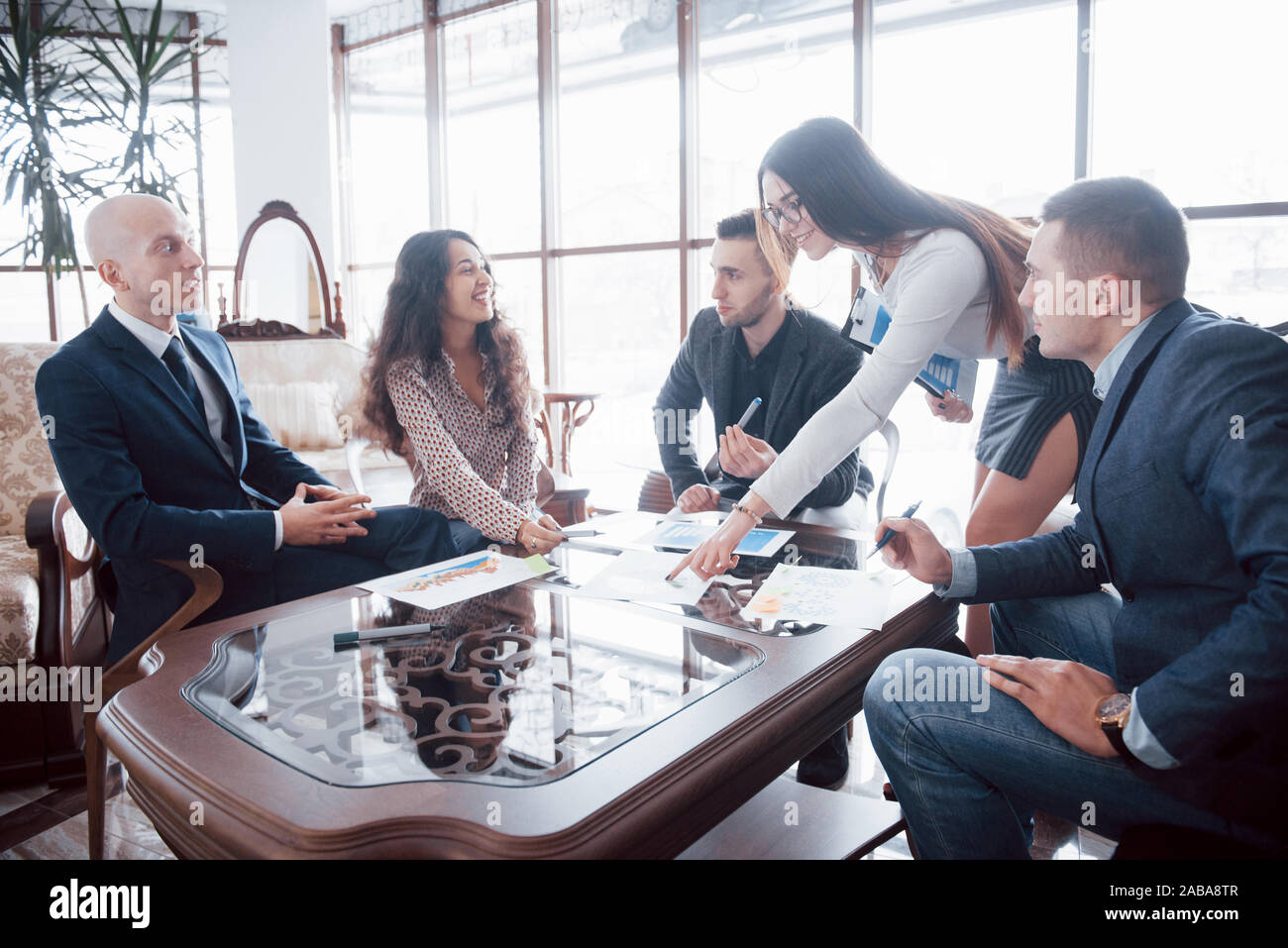 Young team of coworkers making great business discussion in modern ...