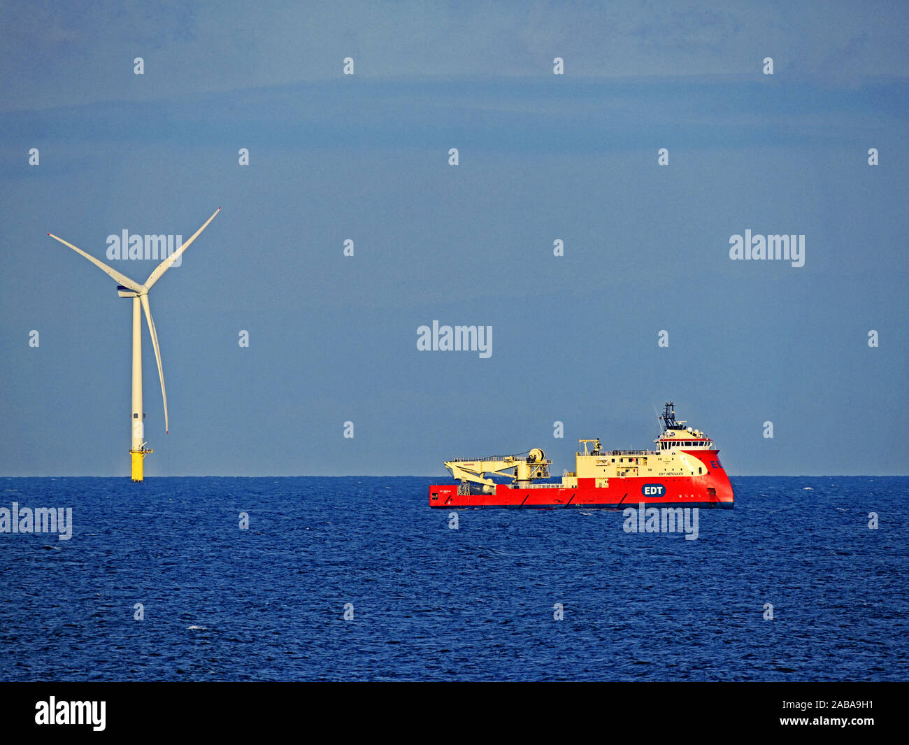 EDT Hercules support vessel by a windfarm turbine North sea Stock Photo ...