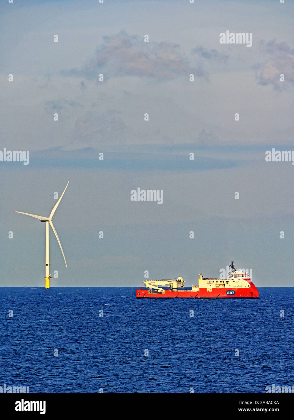 EDT Hercules support vessel by a windfarm turbine North sea Stock Photo ...
