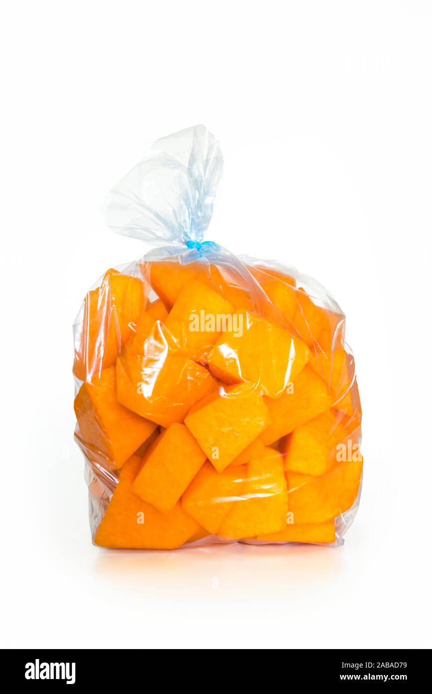 Fresh raw pumpkin pieces in plastic bag ready to be frozen in the ...