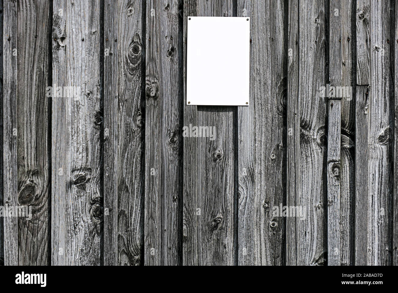 small white piece of paper with tacks pinned on old wood wall Stock ...