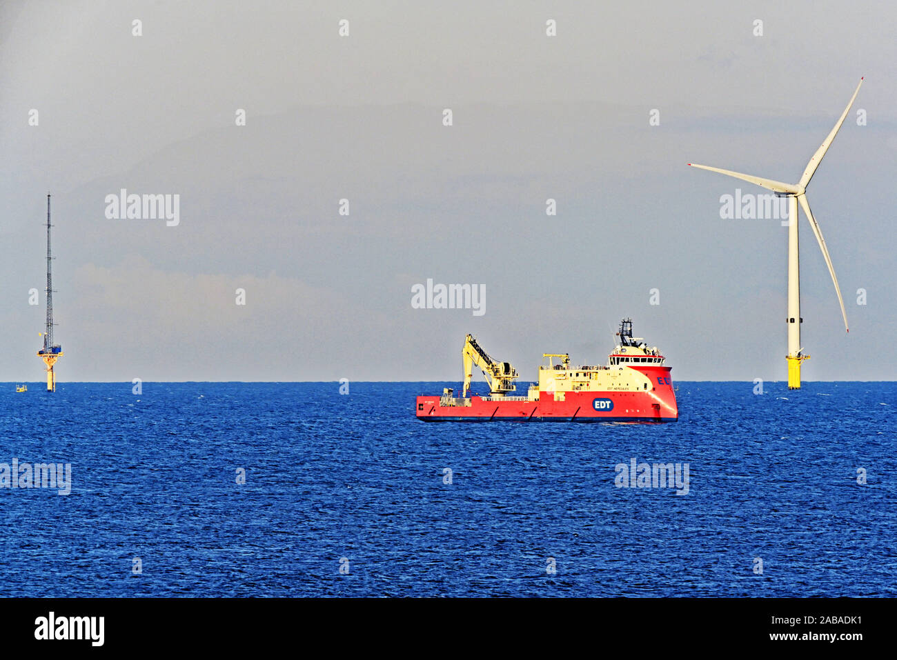EDT Hercules support vessel by a windfarm turbine and SEAROC platform ...
