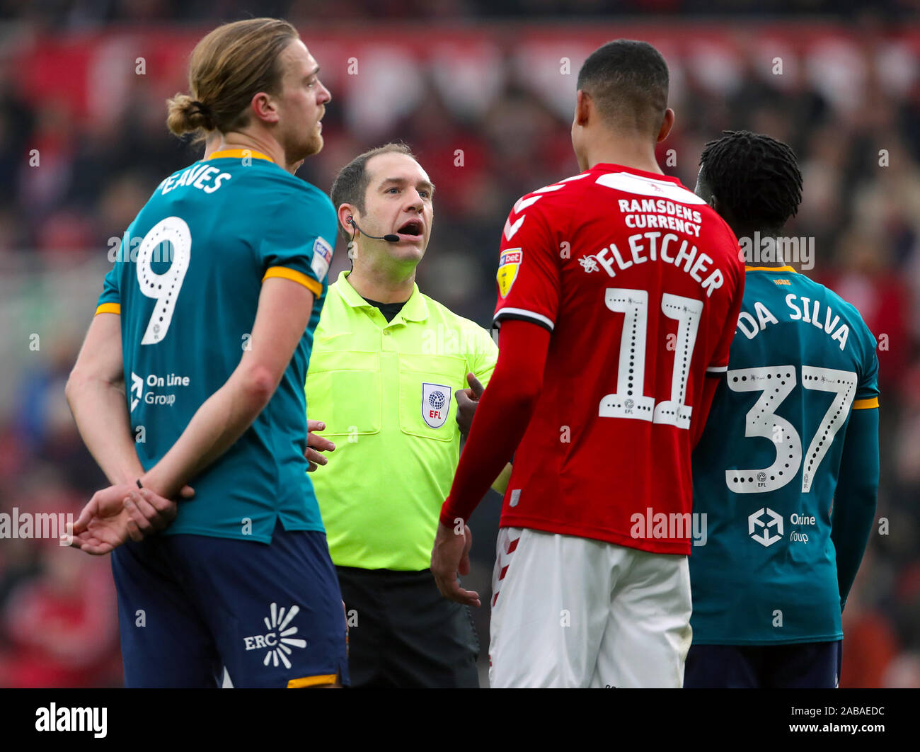 Referee Jeremy Simpson speaks to Hull City's Tom Eaves (left) and ...