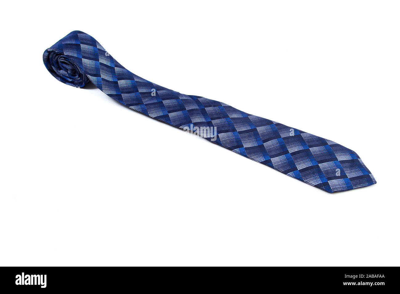 blue tie pattern in rhombuses.classic men's tie folded in a roll ...