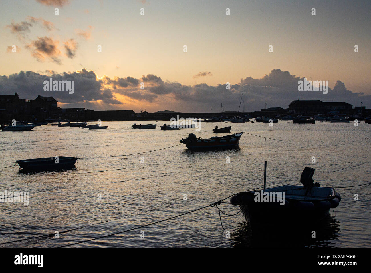 Boats in St Mary's Harbour, Isles of Scilly, at dusk Stock Photo - Alamy