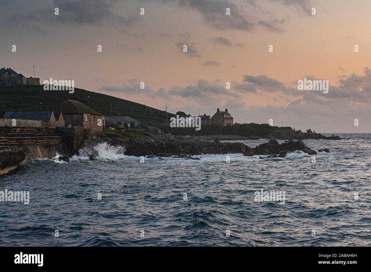 St Mary's quay, Rat Island and The Garrison, Isles of Scilly at dusk ...