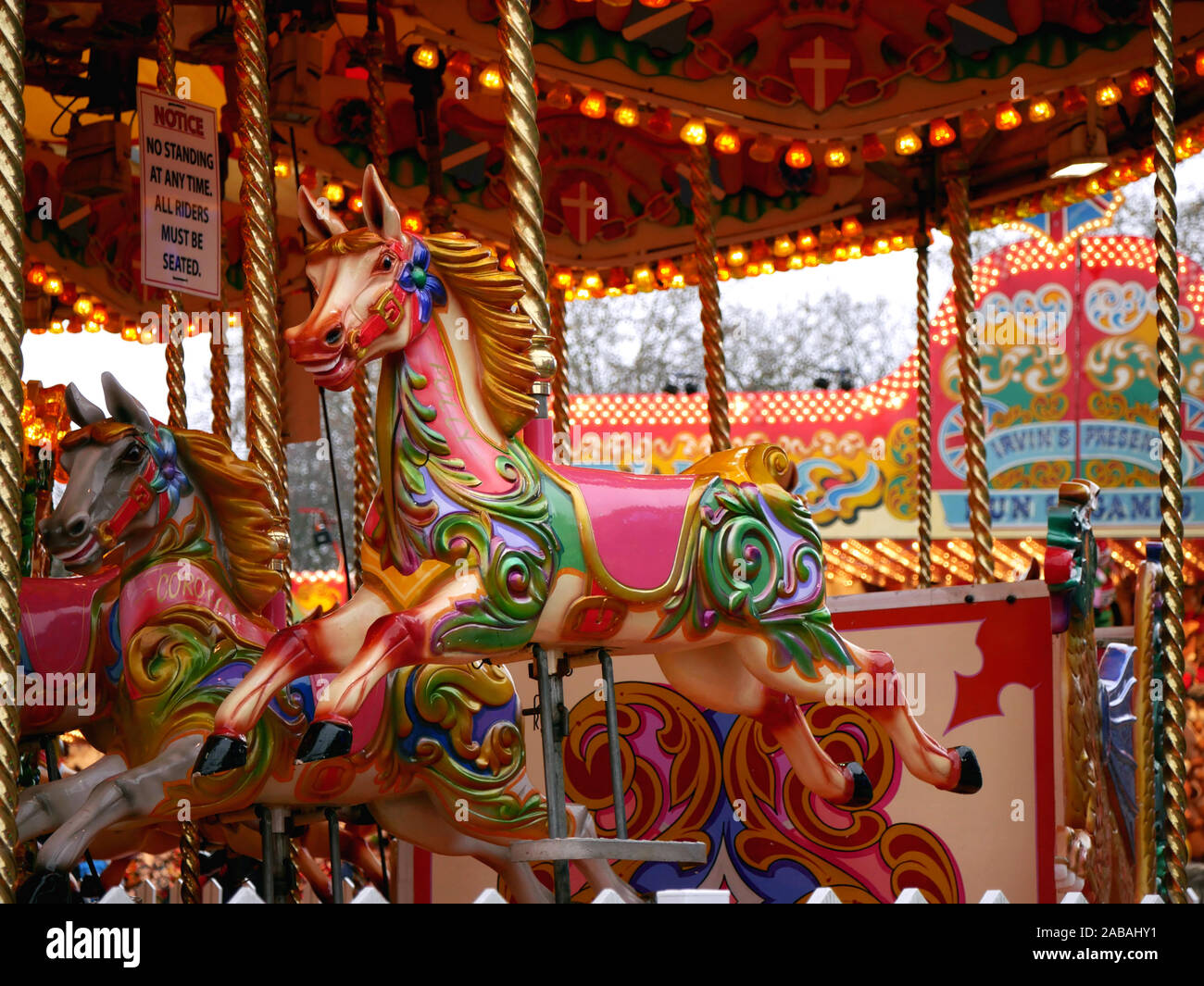Colourful carousel horses at a fair ground Stock Photo - Alamy