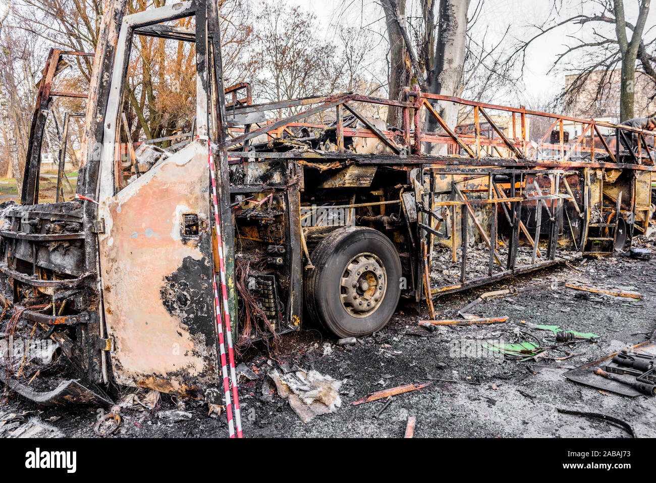 Burnt bus is seen on the street after caught in fire during travel ...