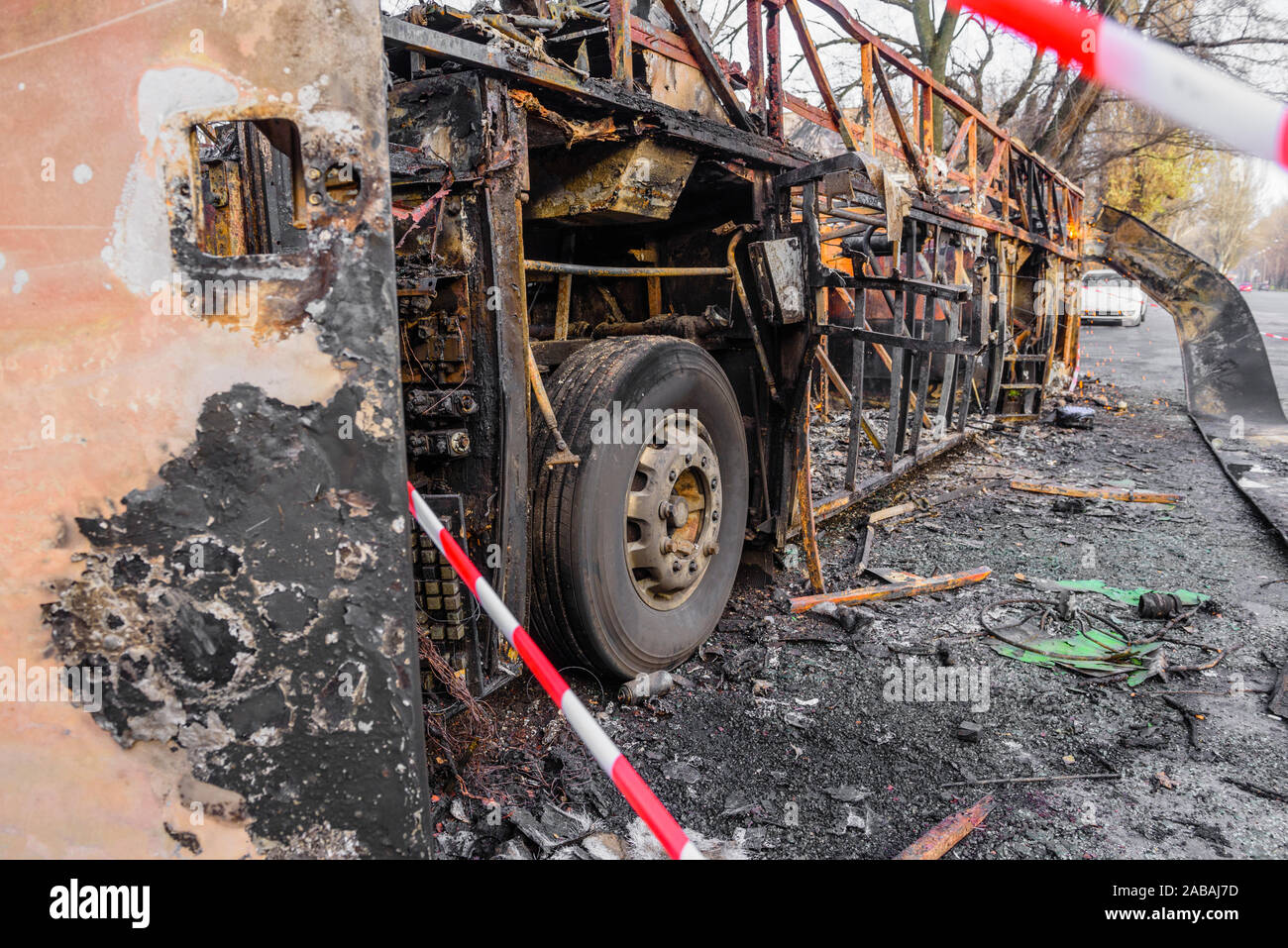 Burnt bus is seen on the street after caught in fire during travel ...
