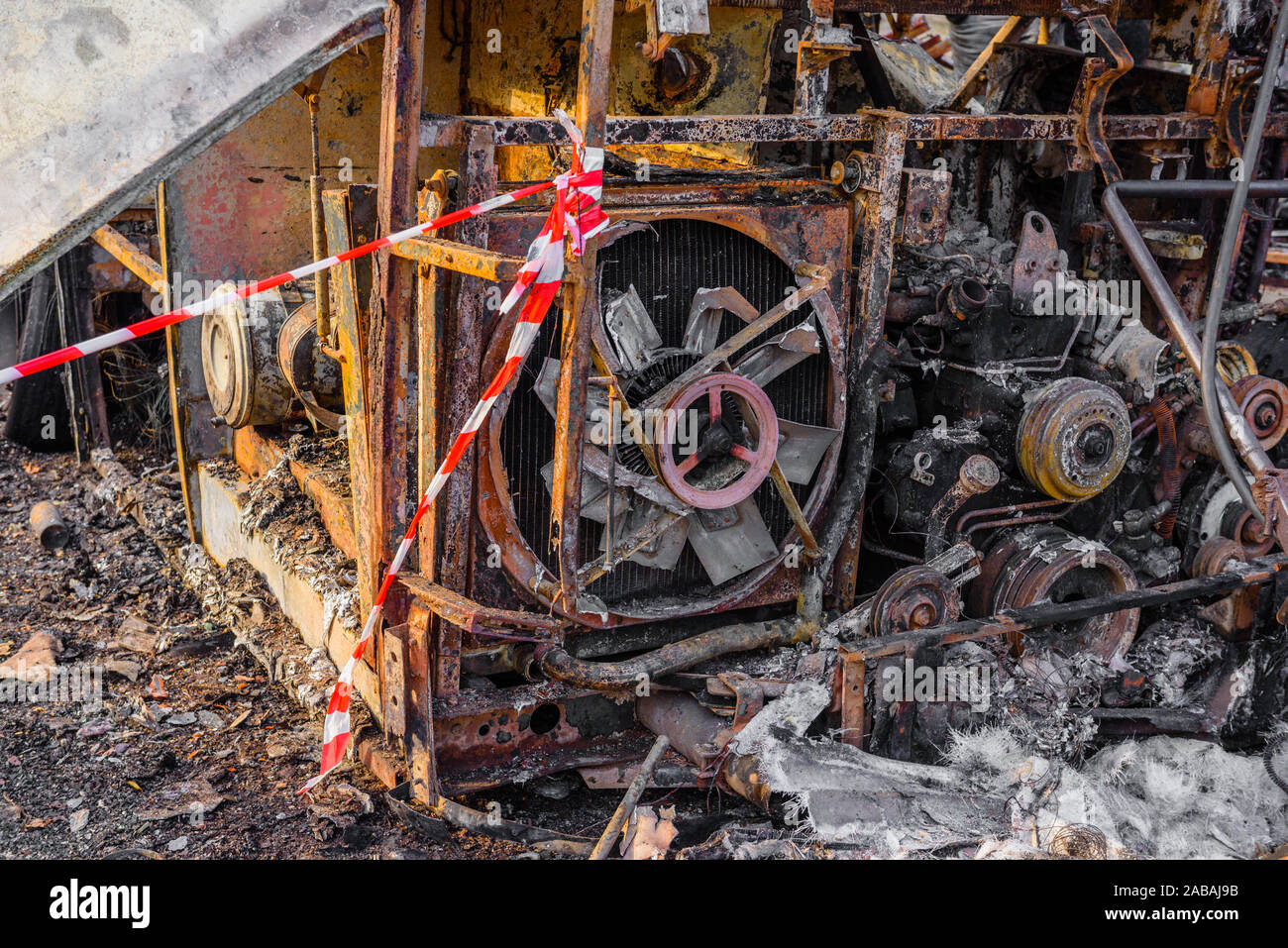 Burnt bus is seen on the street after caught in fire during travel ...