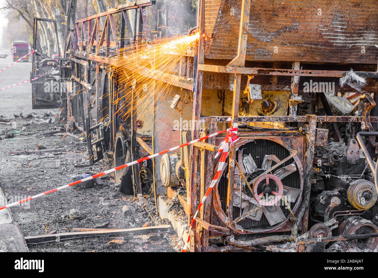 Burnt bus is seen on the street after caught in fire during travel ...