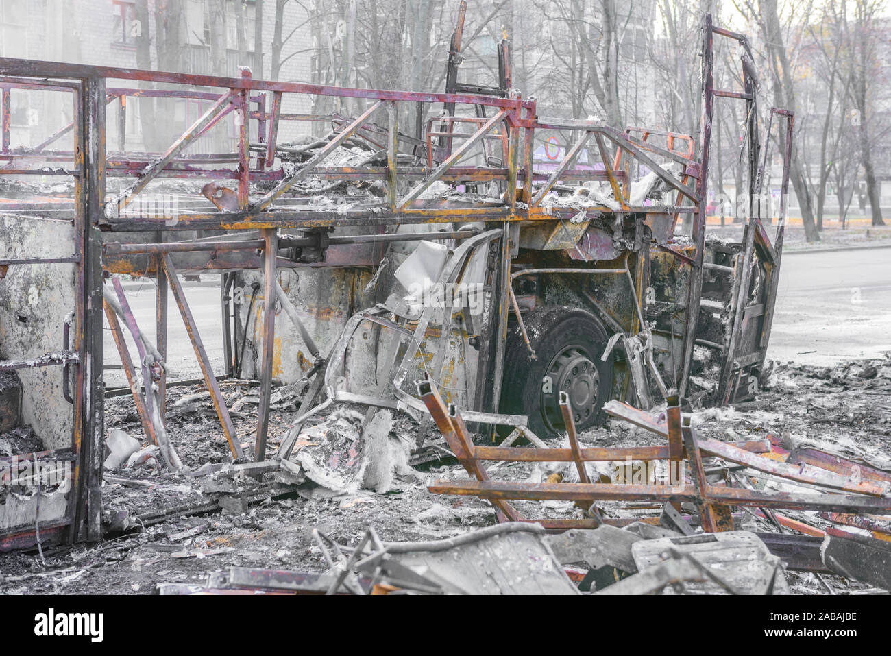 Burnt bus is seen on the street after caught in fire during travel ...
