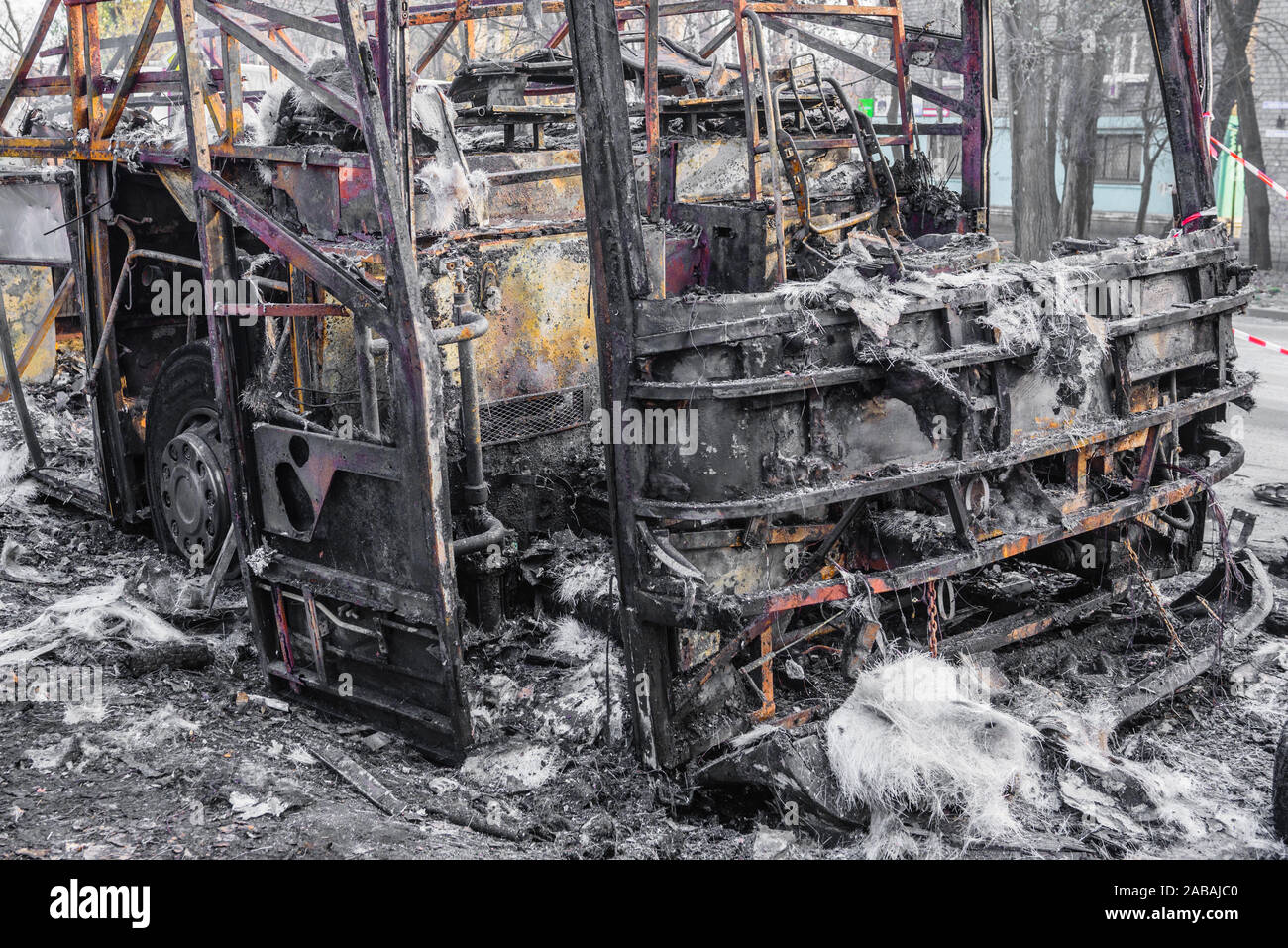 Burnt bus is seen on the street after caught in fire during travel ...