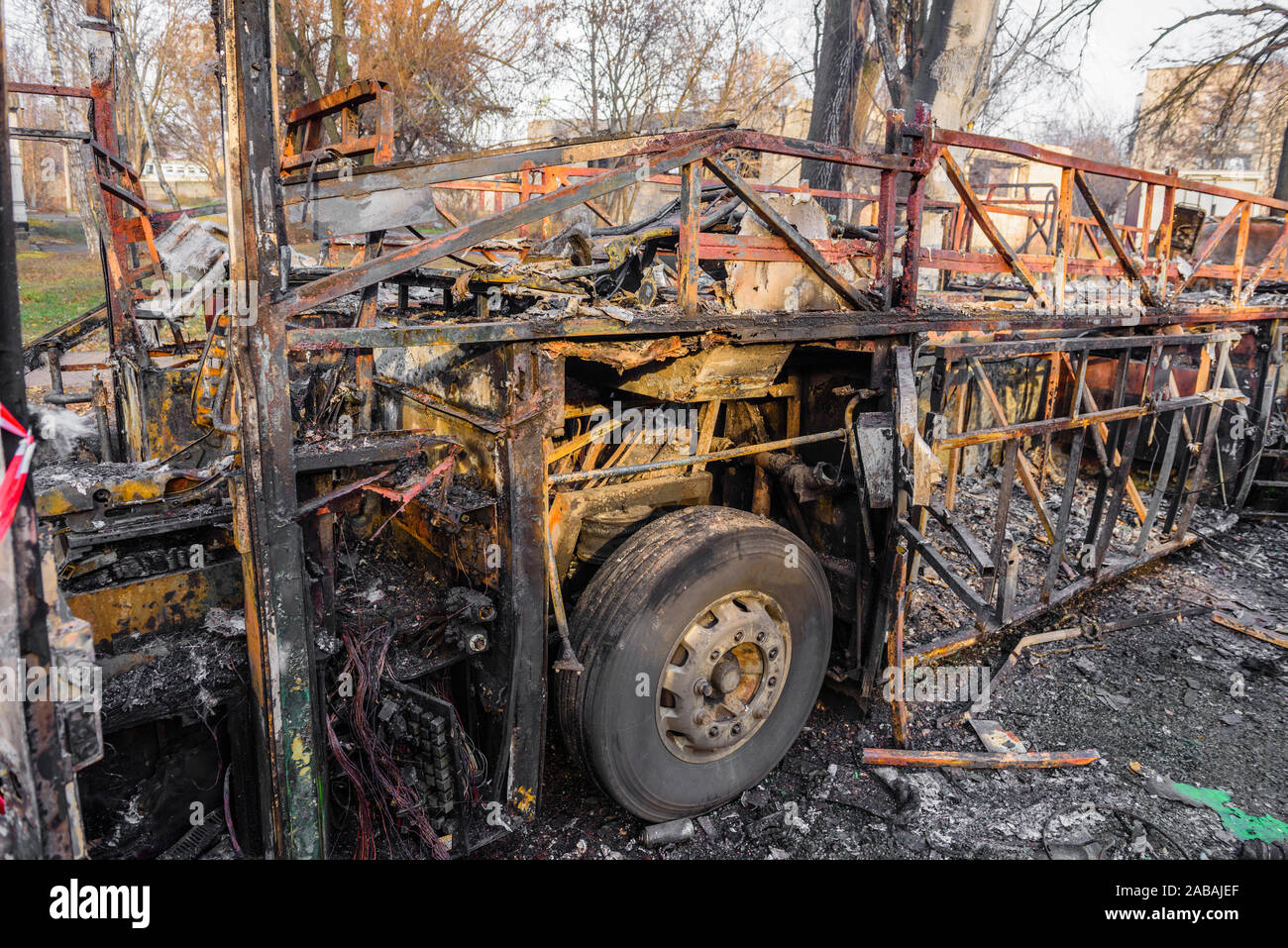 Burnt bus is seen on the street after caught in fire during travel ...