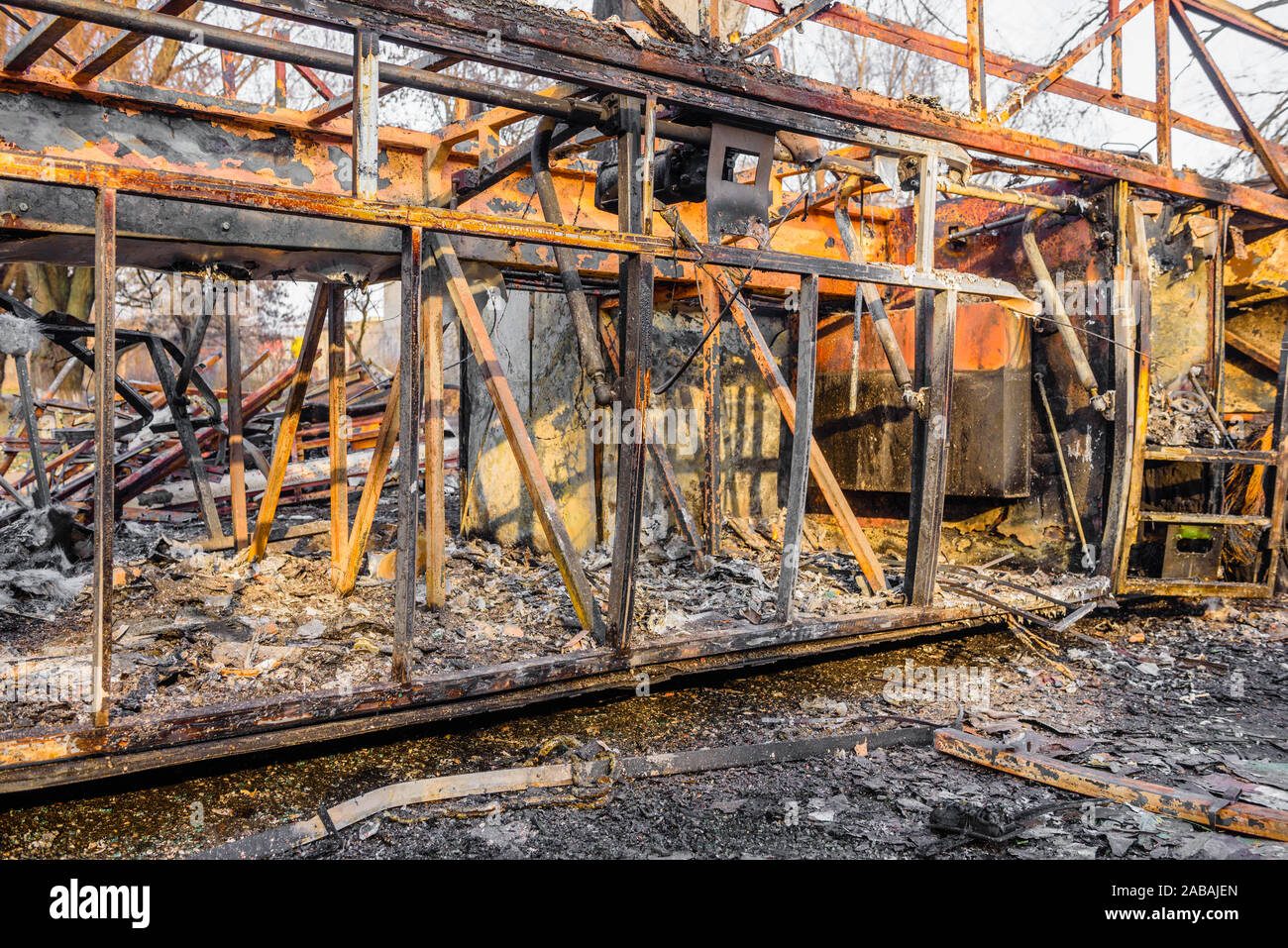 Burnt bus is seen on the street after caught in fire during travel ...