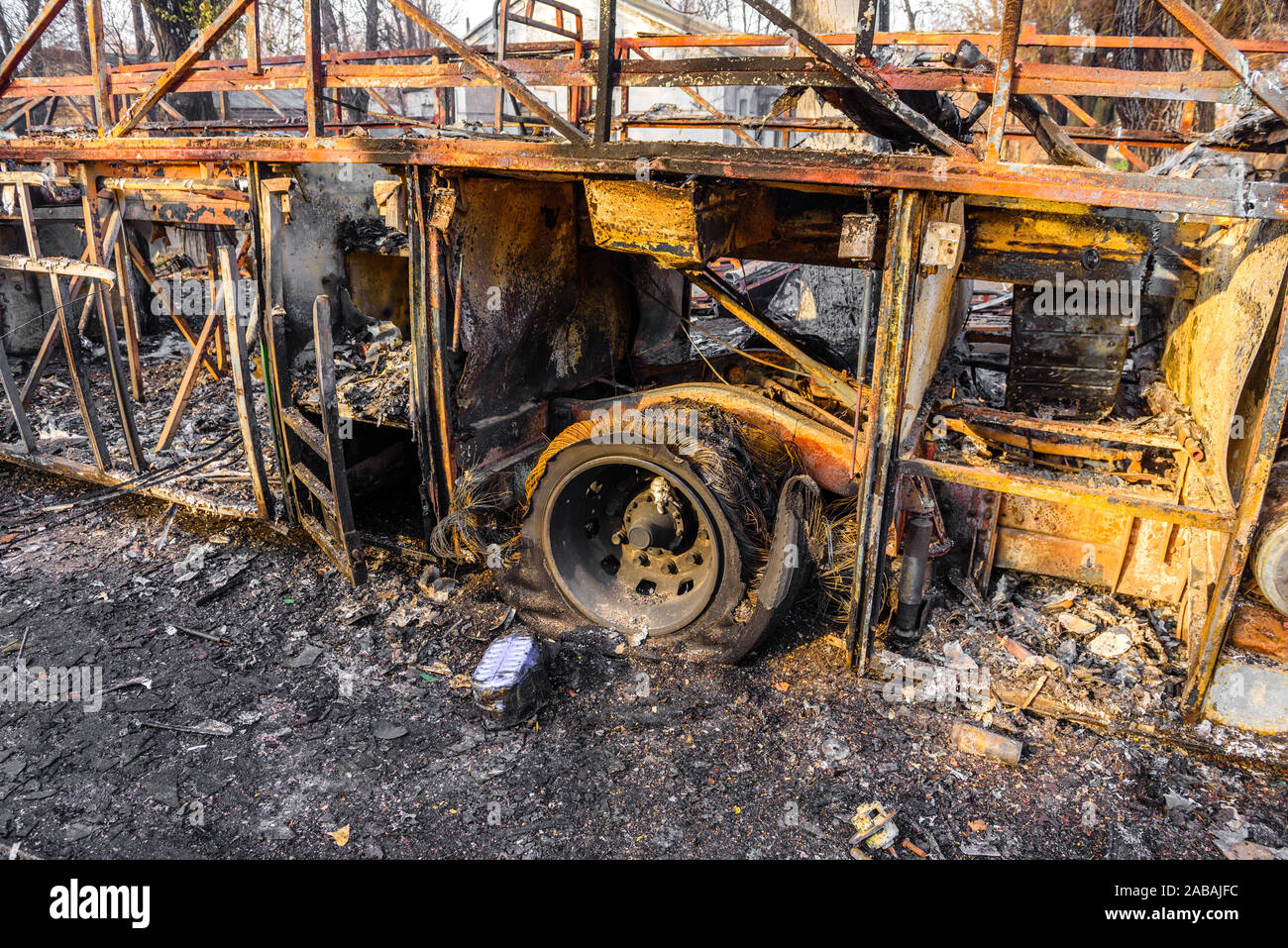 Burnt bus is seen on the street after caught in fire during travel ...