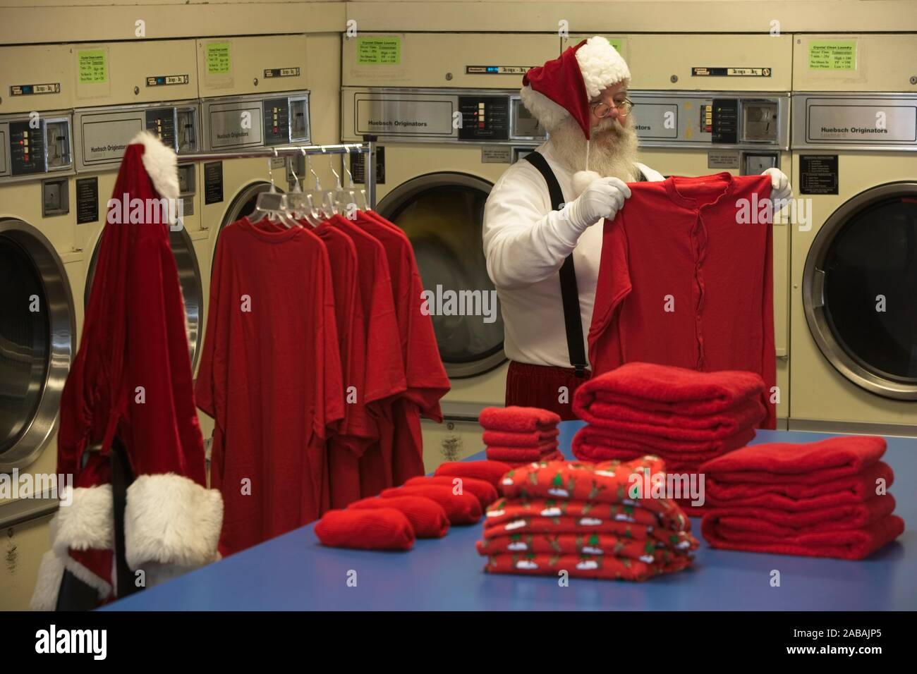 Santa taking care of all of his laundry post-Christmas Stock Photo - Alamy