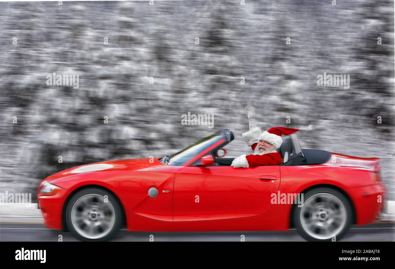 Santa Claus driving a bright red BMW sports car Stock Photo - Alamy