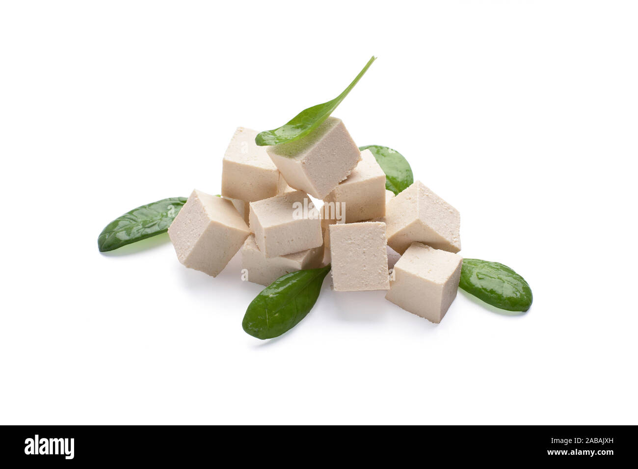 Uncooked tofu and green leaves of fresh spinach Stock Photo - Alamy