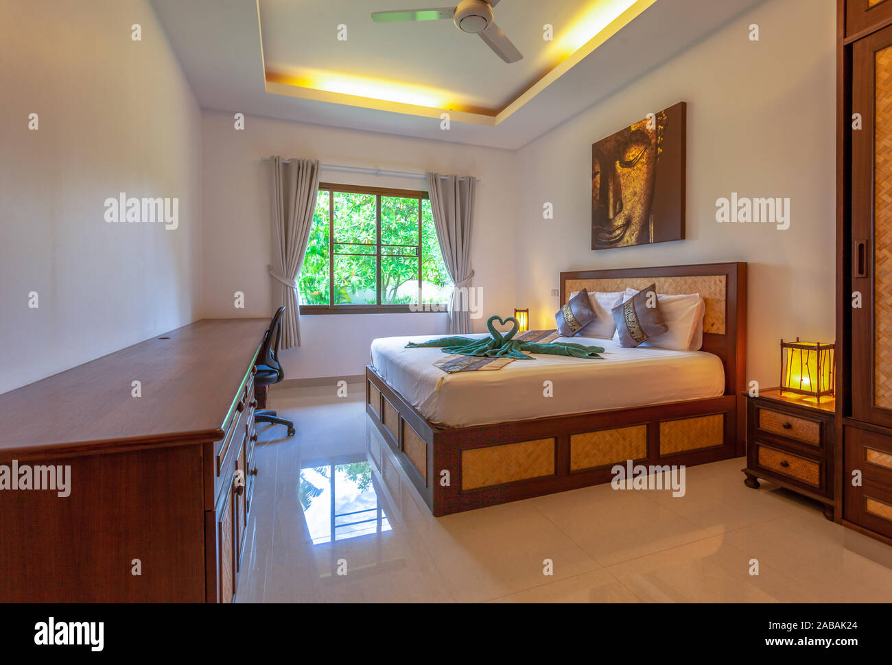 Large bedroom with a large bed in nature style Stock Photo - Alamy