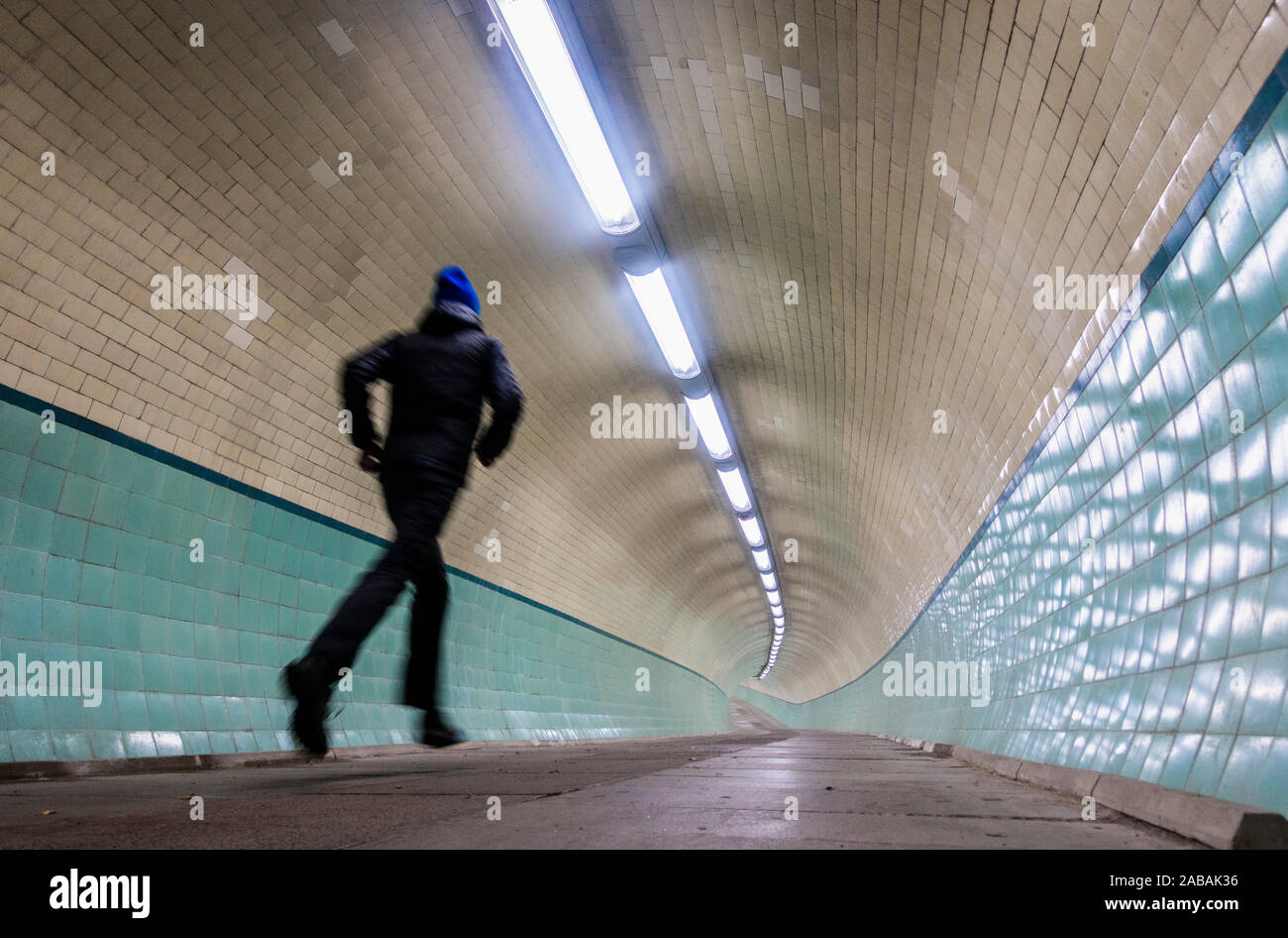 Howden, North Tyneside, England. UK. 26th November, 2019. A jogger ...