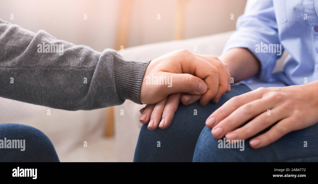 Psychologist consoling his female patient at personal therapy Stock ...