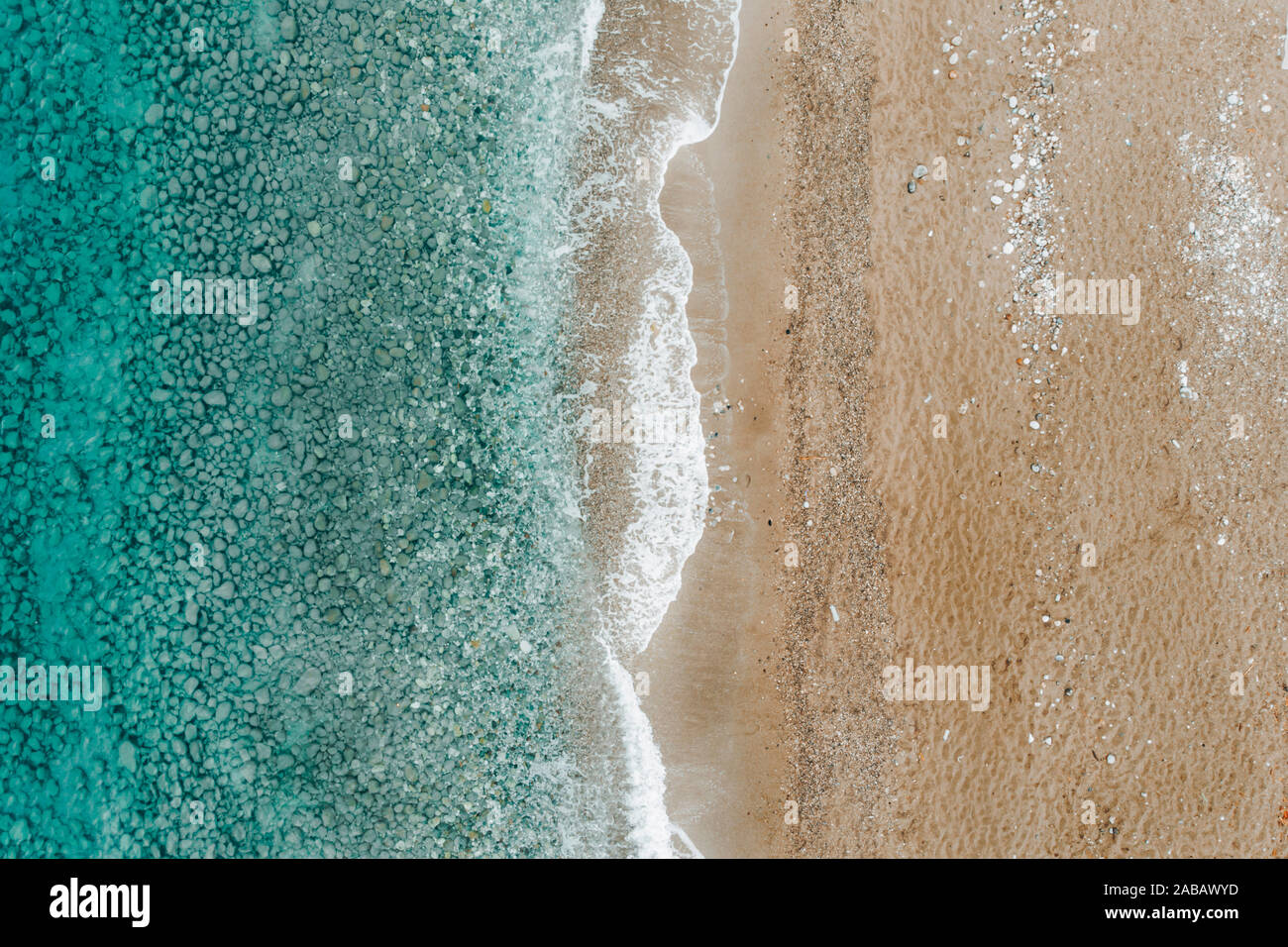 Aerial view of azure ocean and sandy beach. Beautiful seascape captured ...