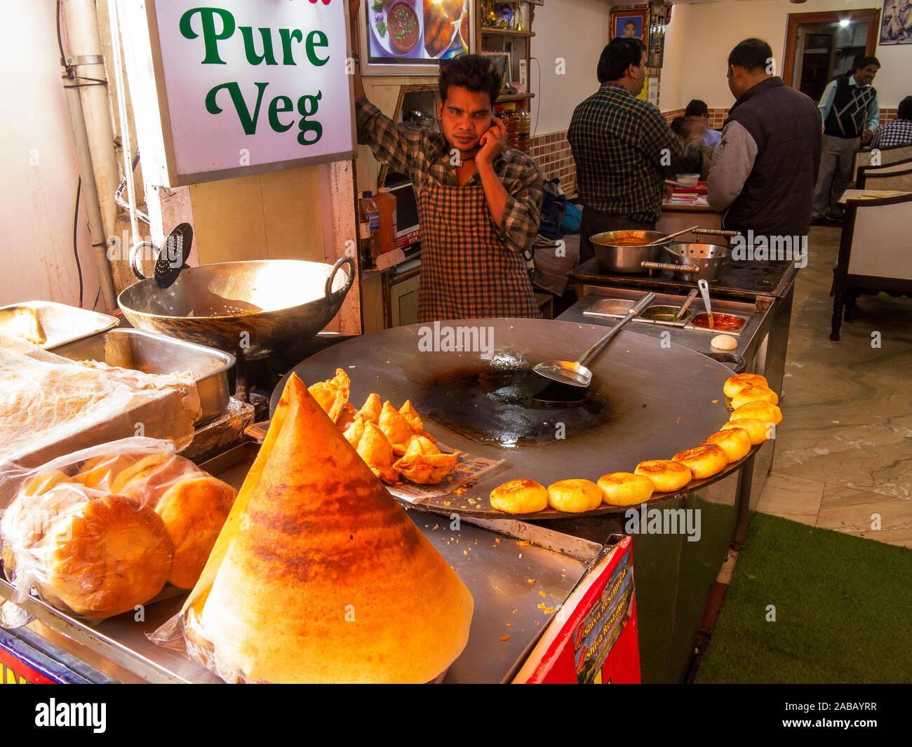 Indian snacks on display at an restaurant at Bara Bazar, Nainital ...