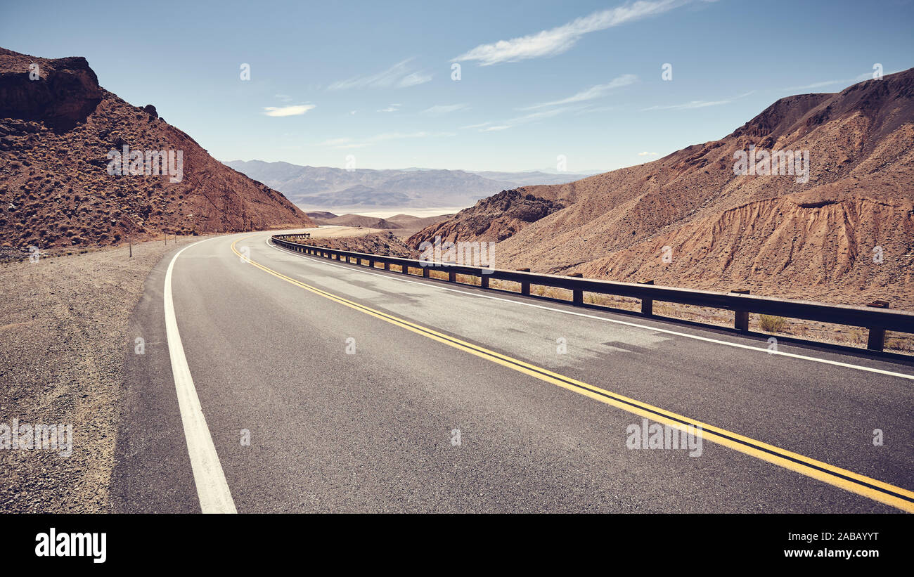 Empty desert road in Death Valley, color toning applied, USA Stock ...