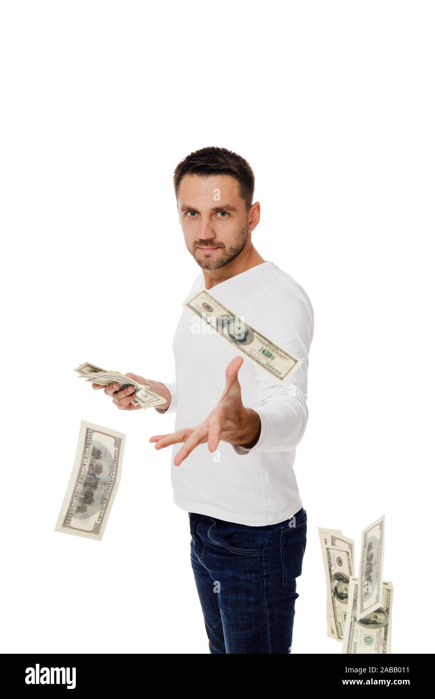 young man throwing money banknotes at camera isolated on white ...