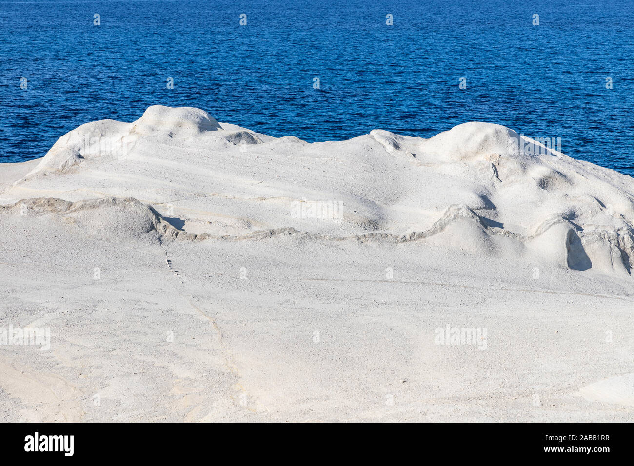 White rocks and sand in Sarakiniko beach, Milos, Greece Stock Photo - Alamy