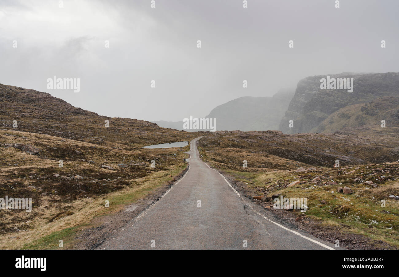 View of single track road and passing place on Bealach na Ba pass on ...