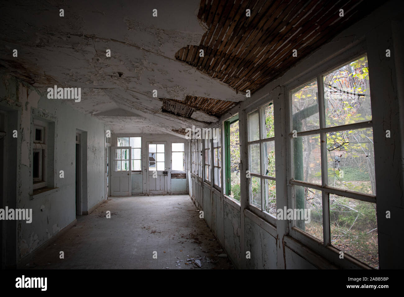 Interior of a dirty an empty demolished abandoned room with broken ...