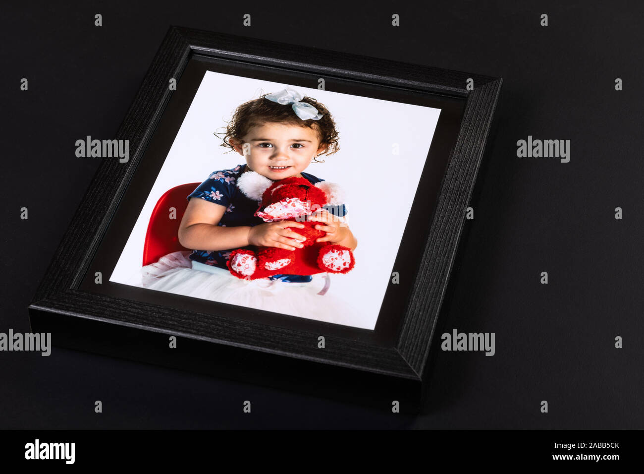 Girl hugging picture in frame hi-res stock photography and images - Alamy