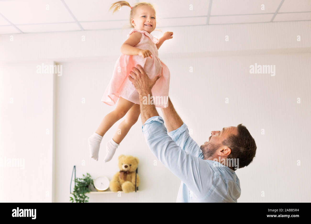 Throwing baby in air hi-res stock photography and images - Alamy