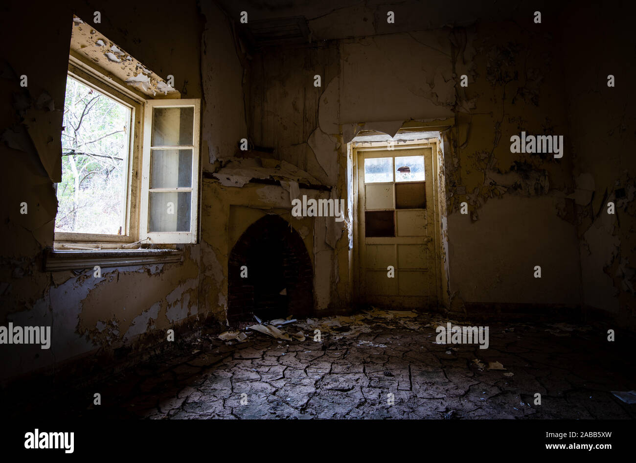 Interior of a dirty an empty demolished abandoned room with broken ...