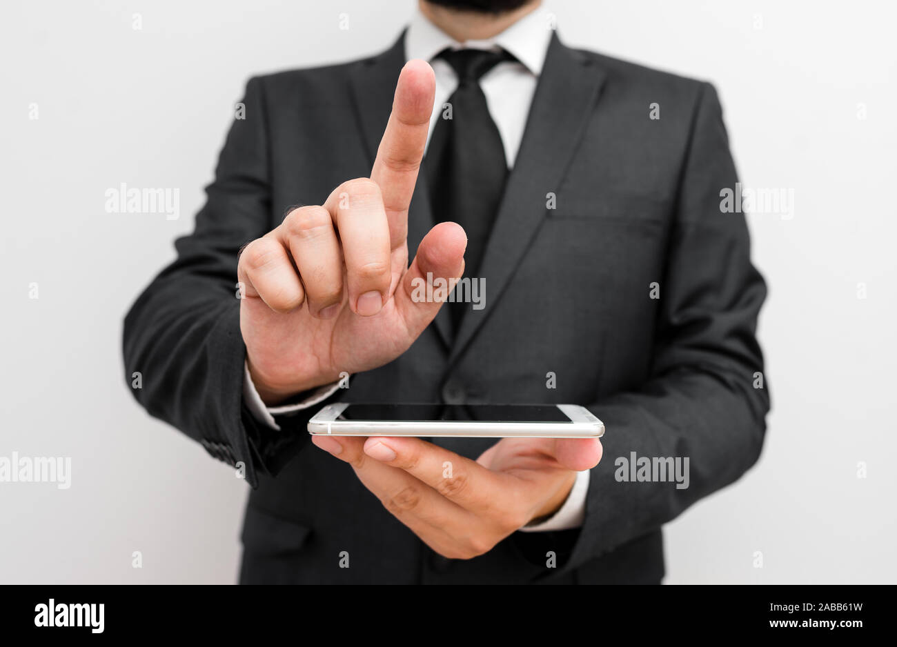 Male human wear formal work suit hold smart hi tech smartphone use one ...