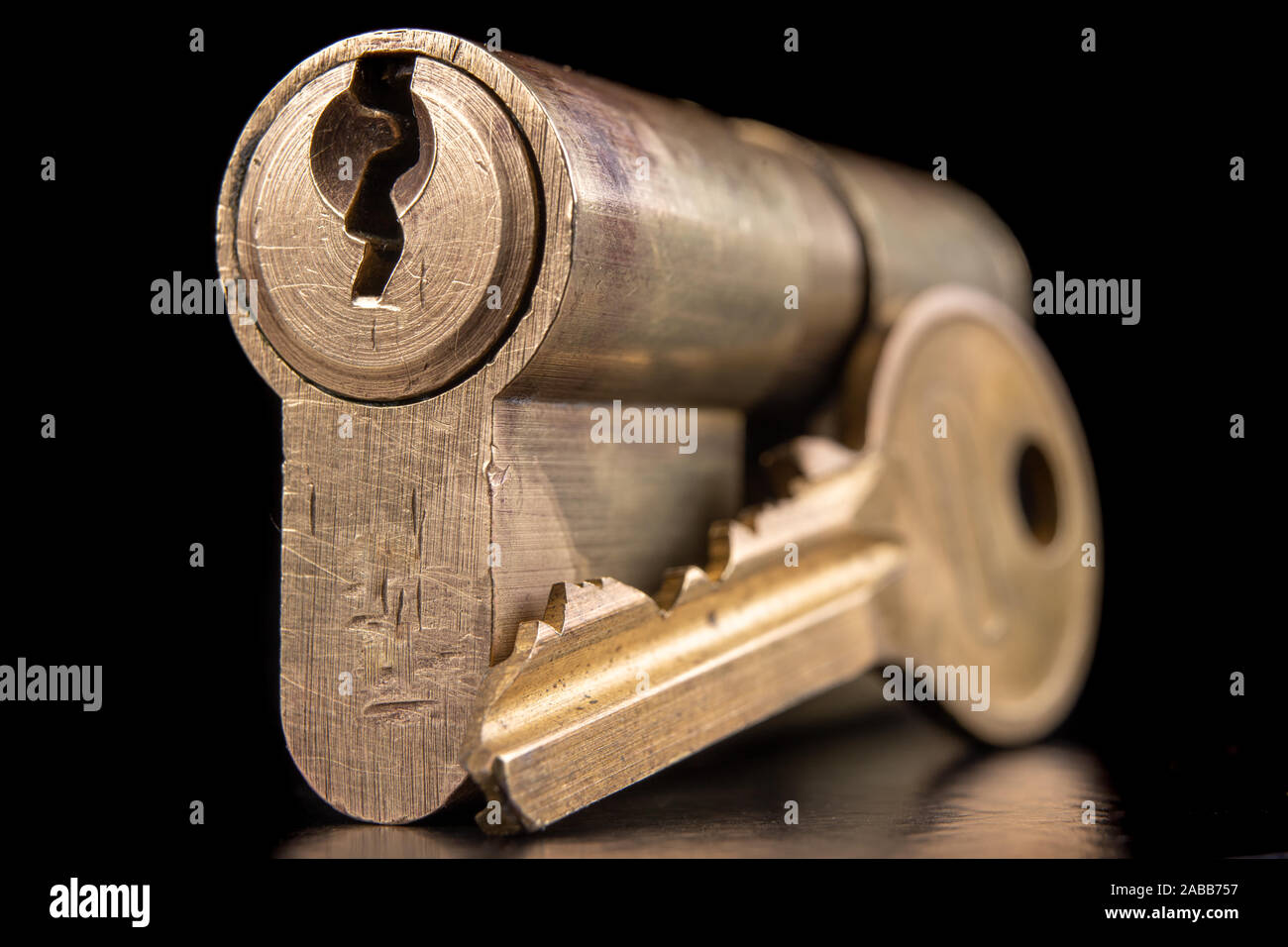 A old door lock on a dark background. A patent and keys to secure the ...
