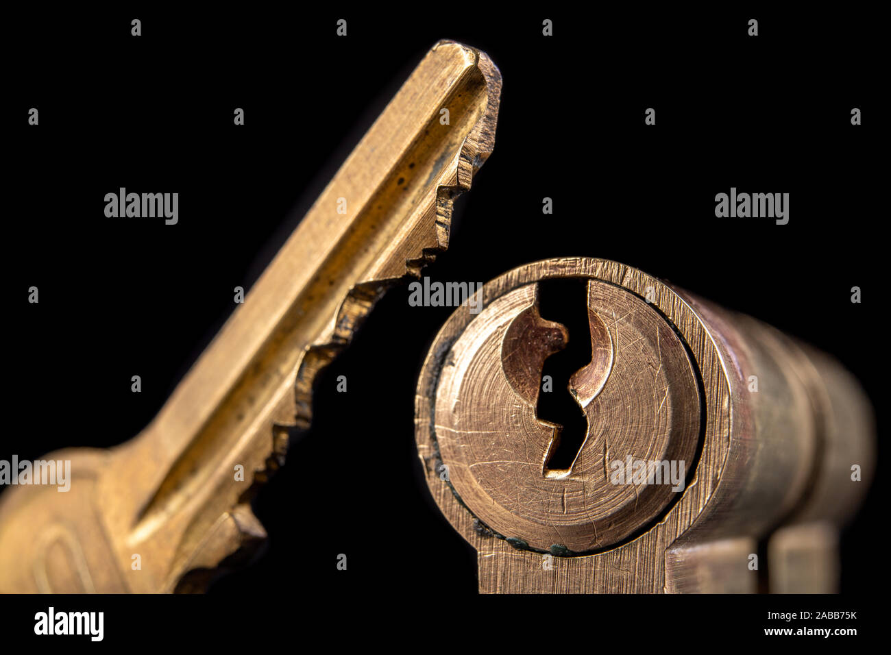 A old door lock on a dark background. A patent and keys to secure the ...