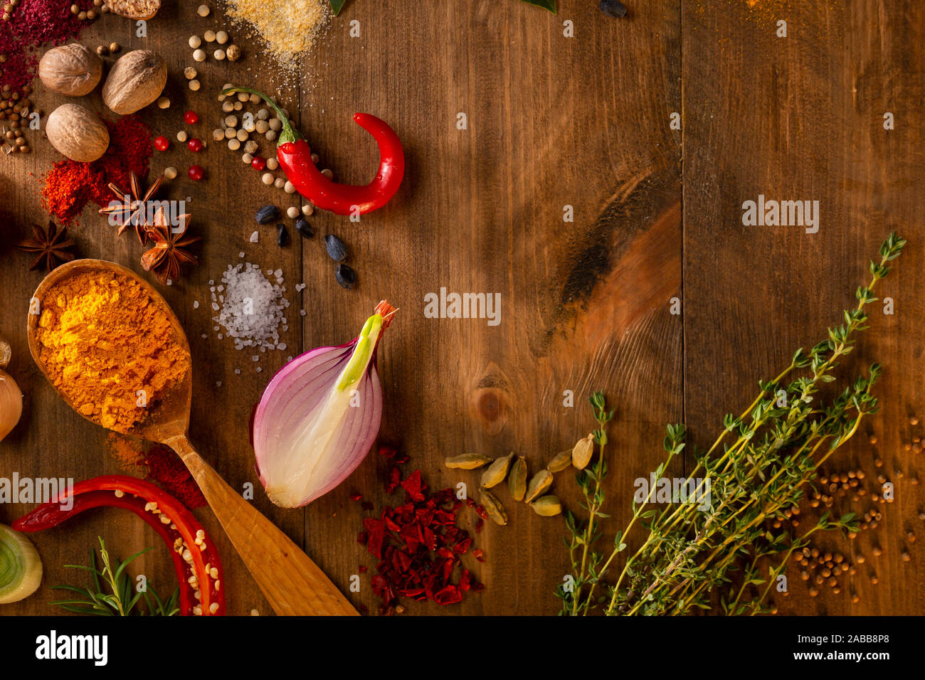 Wooden background with seasoning and spices, food concept Stock Photo ...