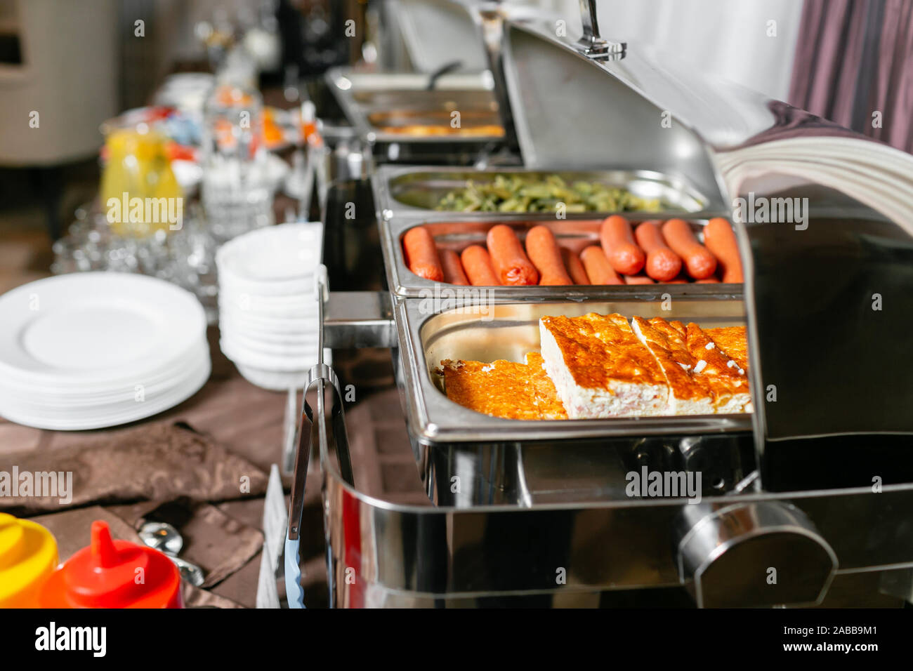 Breakfast buffet in hotel. Lots of heated trays ready for service ...