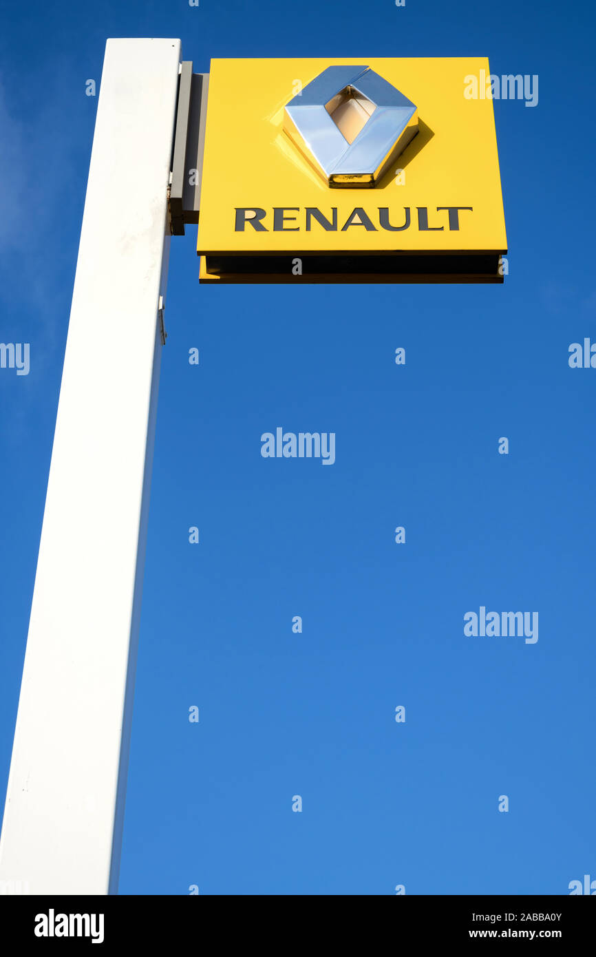 Renault dealership sign against blue sky Stock Photo - Alamy