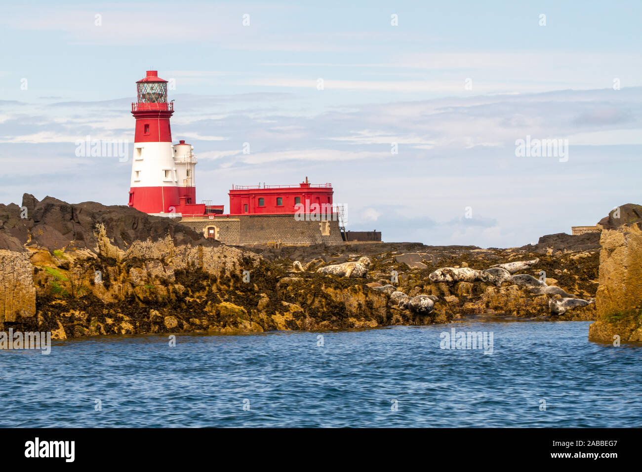 Longstone Lighthouse in white and red, on Longstone Rock in the outer ...