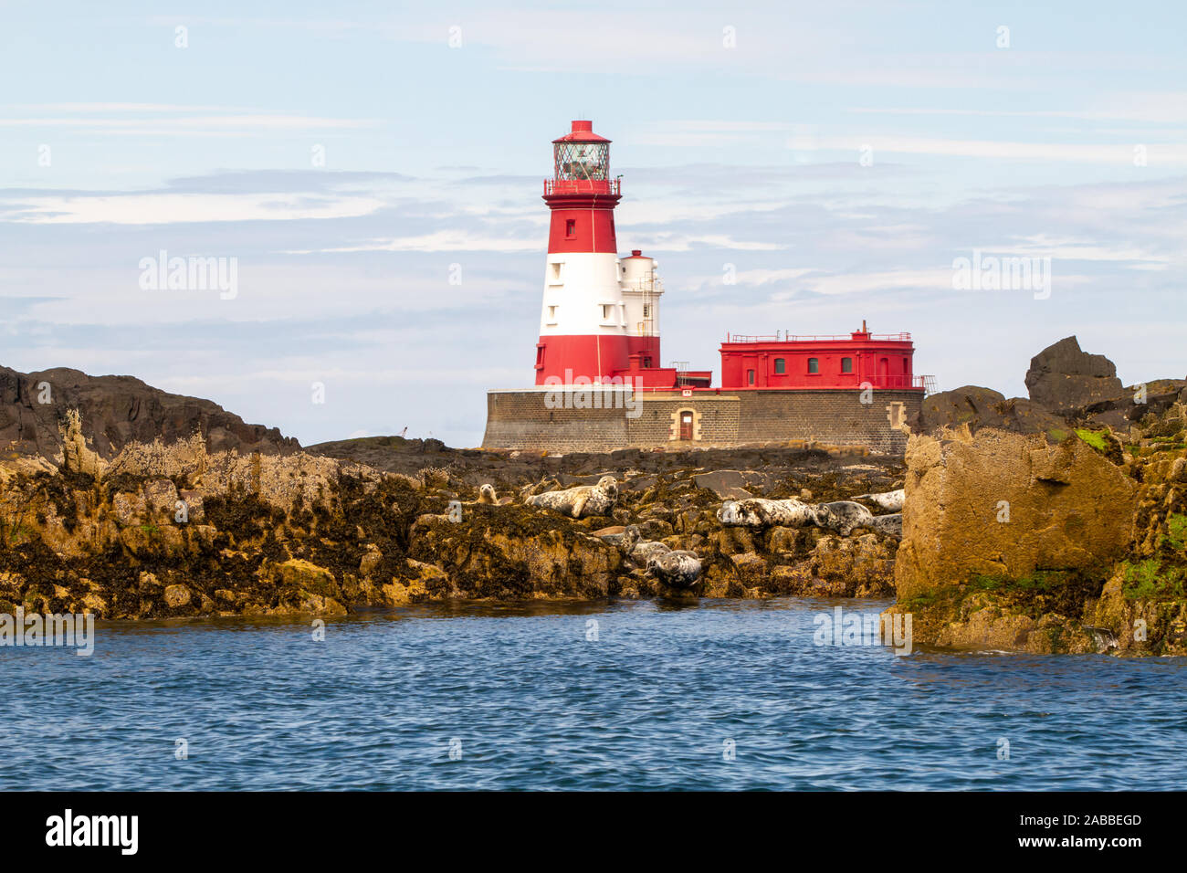 Longstone Lighthouse in white and red, on Longstone Rock in the outer ...